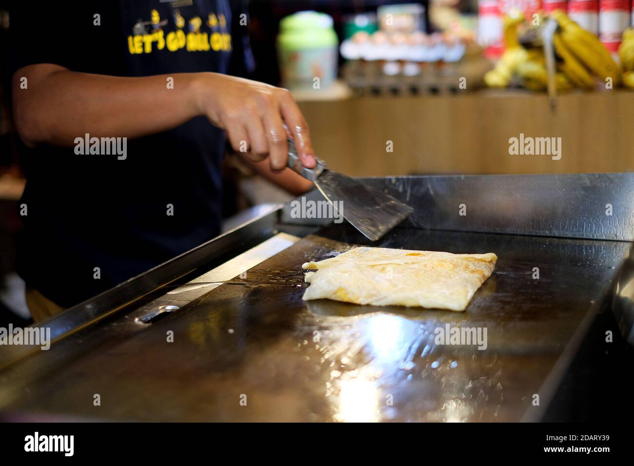 Fried roti with eggs in hot pan 2 Stock Photo - Alamy