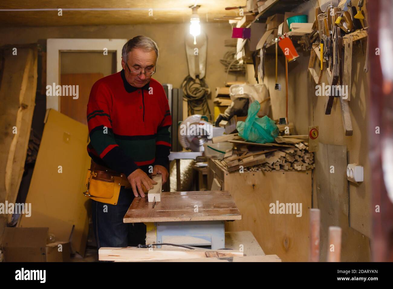 Carpenter doing his job in carpentry workshop Stock Photo - Alamy
