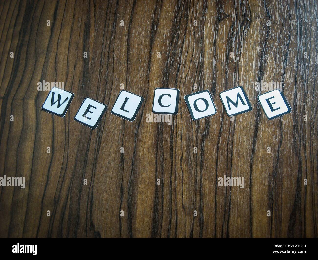 Welcome letter on brown background. Welcome word Stock Photo - Alamy