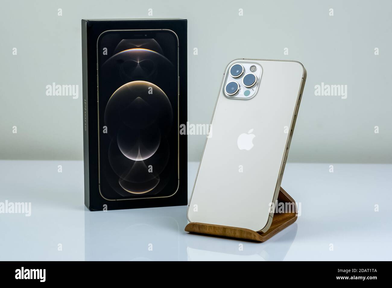 Phone 12 Pro Max in Gold next to iPhone 11 Pro Max in Midnight Green ...