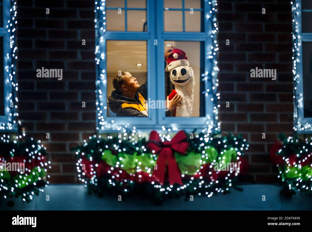 Paul Fenning puts the finishing touches to the Christmas decorations on ...