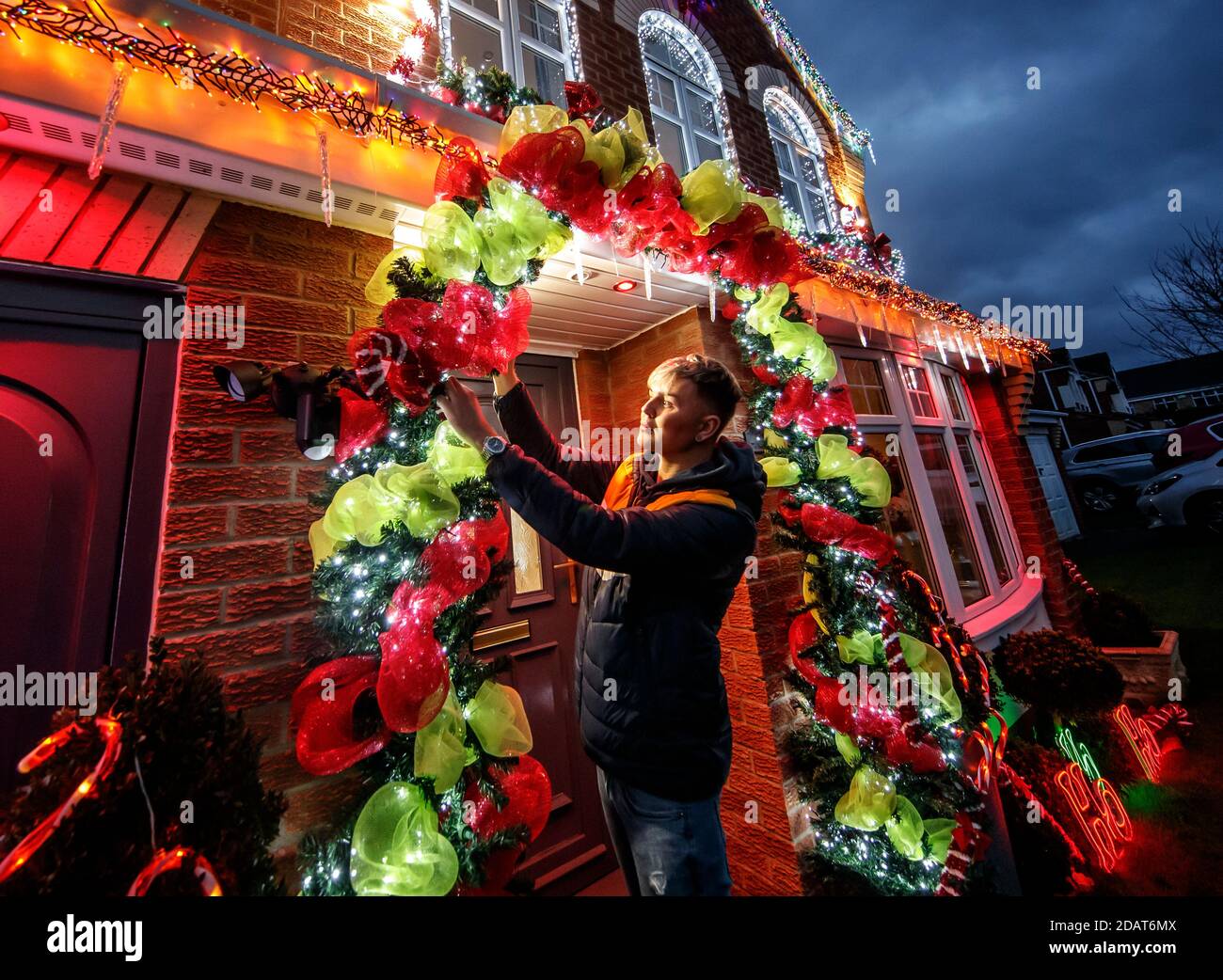 Paul Fenning puts the finishing touches to the Christmas decorations on ...