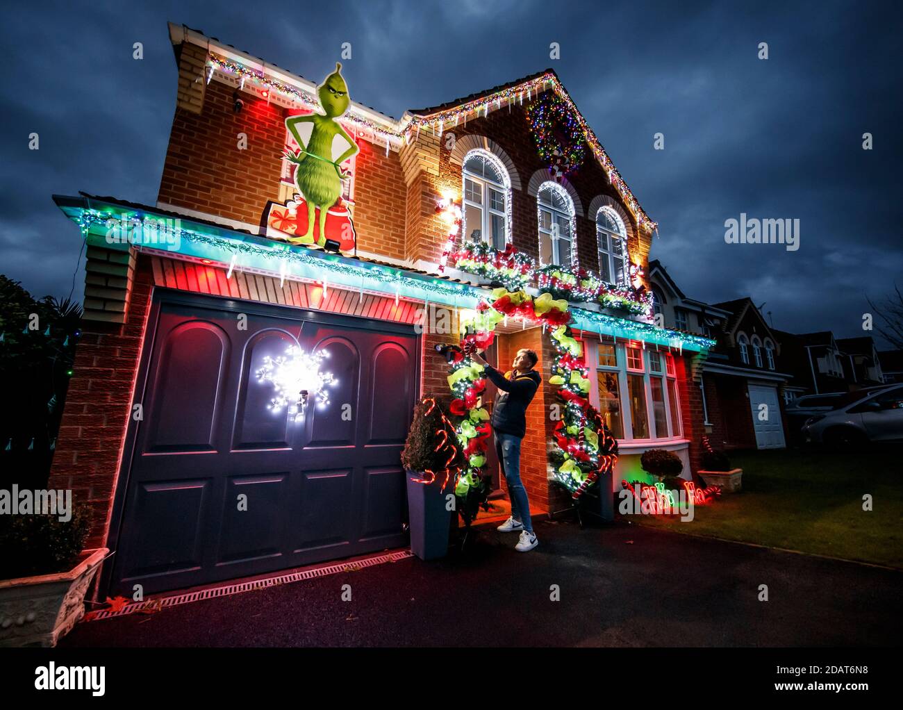 Paul Fenning puts the finishing touches to the Christmas decorations on ...