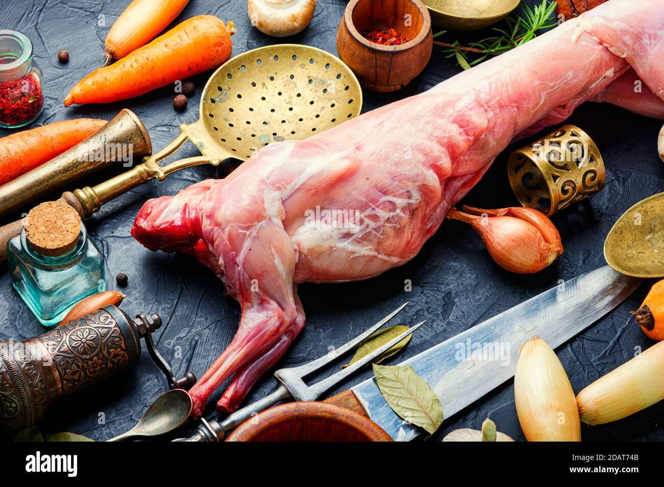 Raw rabbit meat with spice with spice and condiment Stock Photo - Alamy