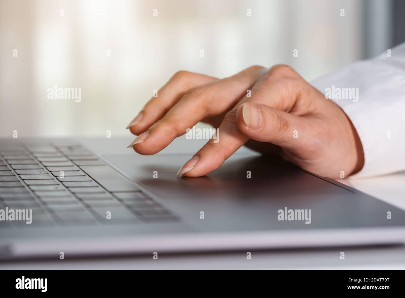 close-up female hand touching touchpad on a laptop computer Stock Photo ...