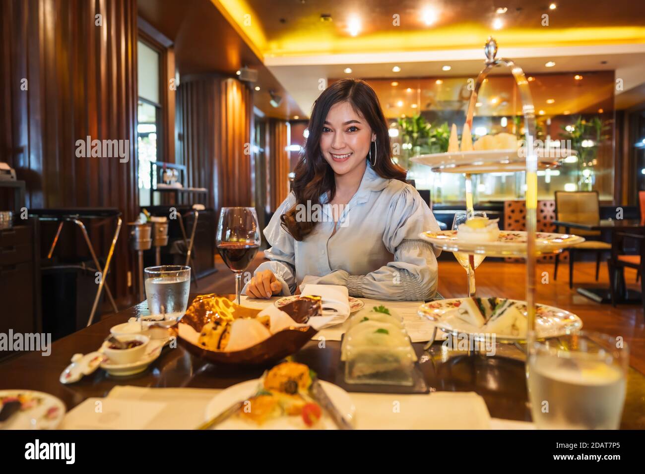 young beautiful woman eating in the restaurant Stock Photo - Alamy