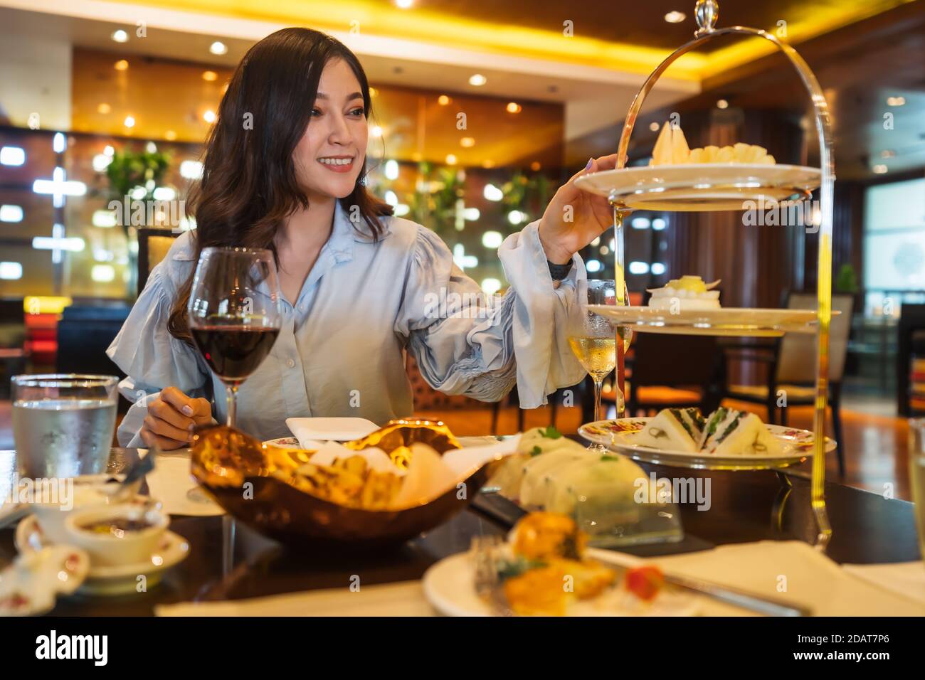 young beautiful woman eating in the restaurant Stock Photo - Alamy