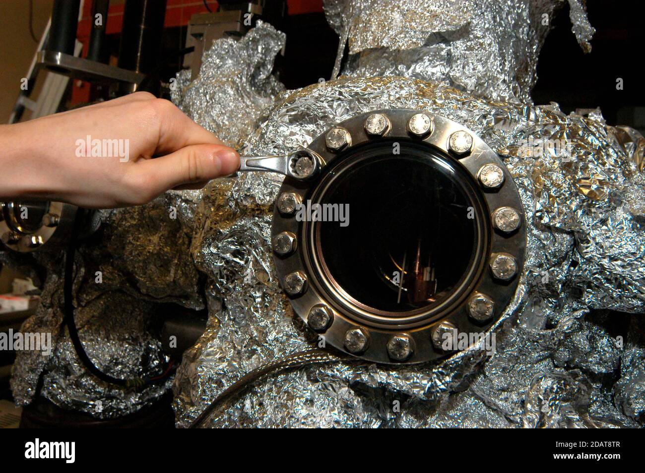 a precision mechanic at his working place using a wrench Stock Photo ...