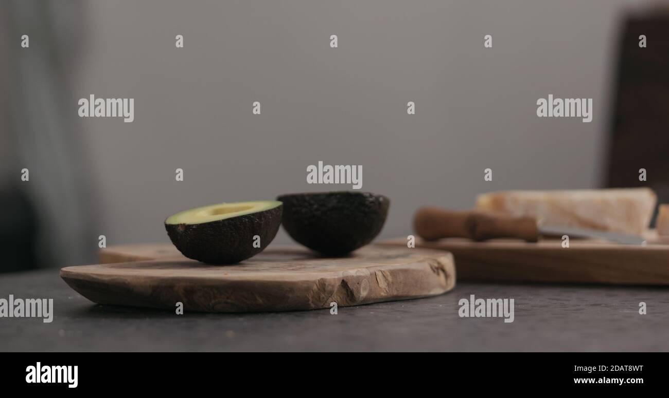 open ripe avocado on kitchen countertop, wide photo Stock Photo - Alamy