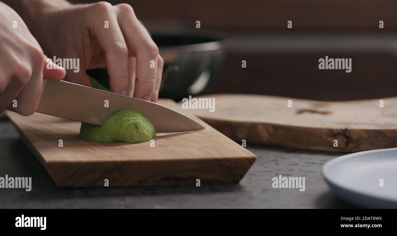 Slow motion man hand slicing hi-res stock photography and images - Alamy