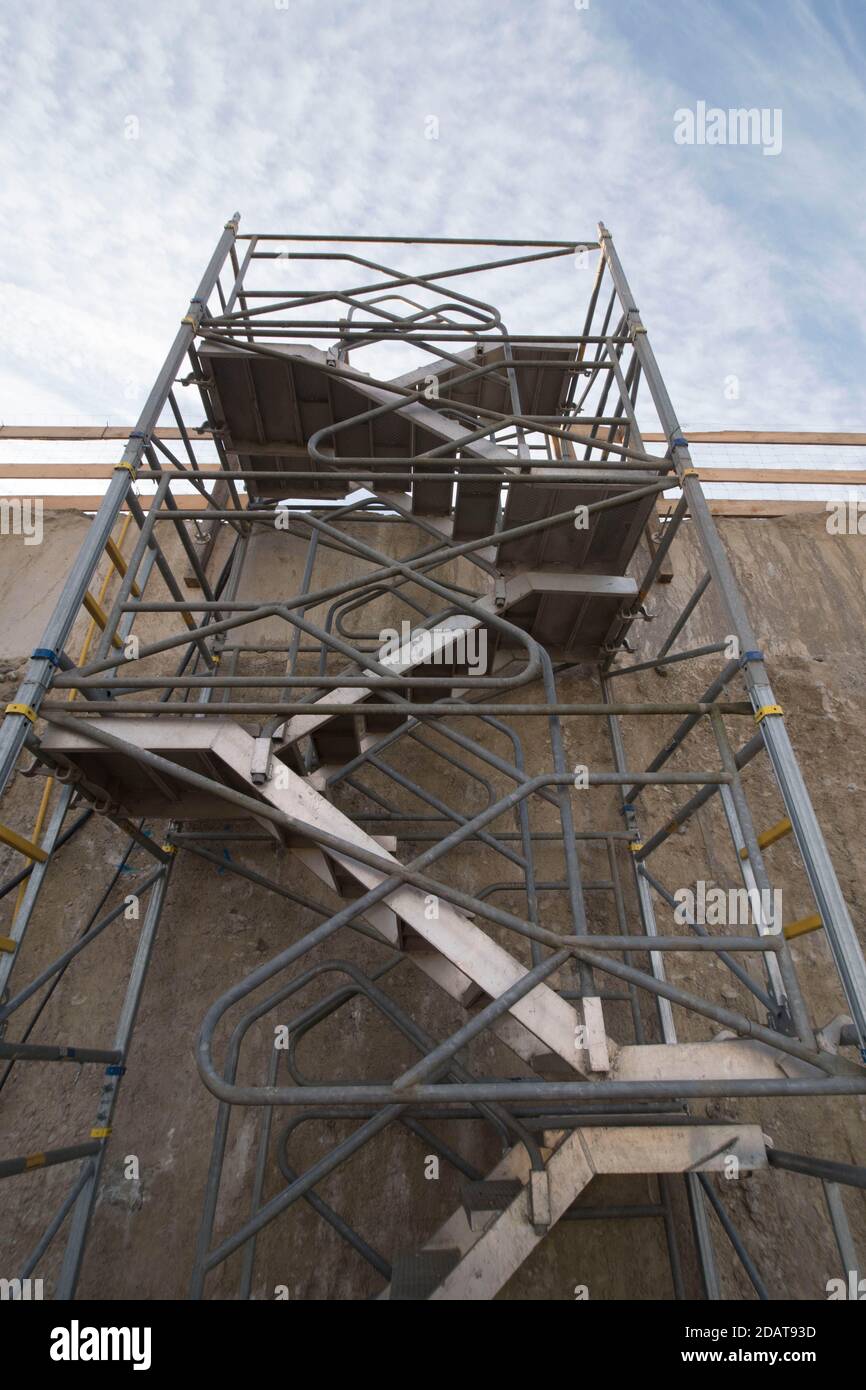 Scaffolding for construction work on a building and sky in the back ...