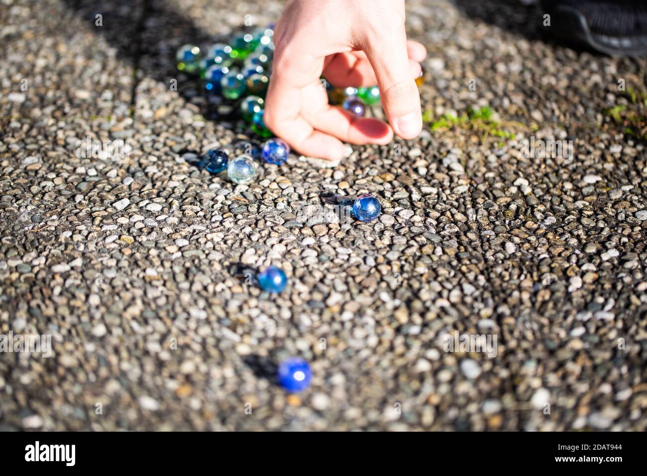 Playing marbles, old children's game, colorful balls Stock Photo - Alamy