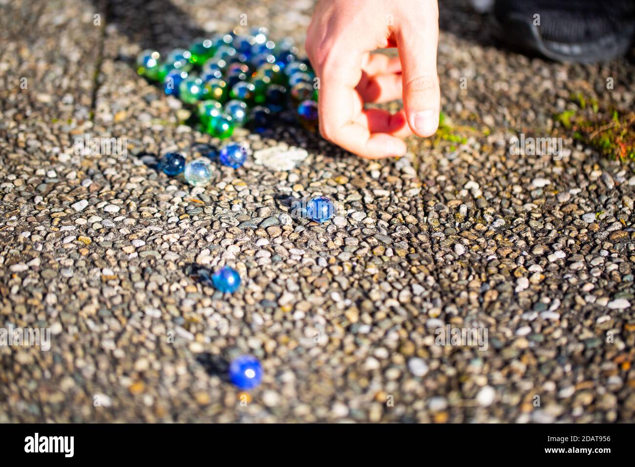 Playing marbles, old children's game, colorful balls Stock Photo - Alamy