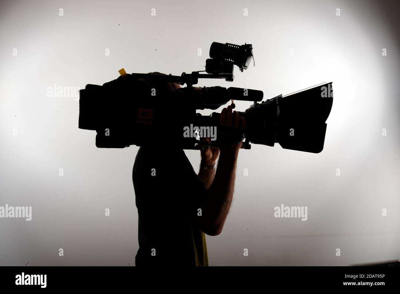camera man with video camera on his shoulder, white background Stock ...