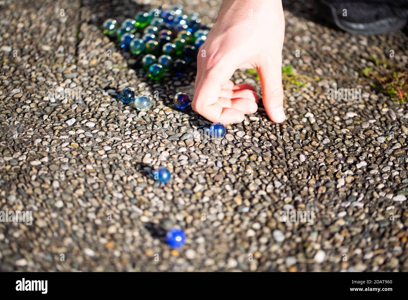 Playing marbles, old children's game, colorful balls Stock Photo - Alamy