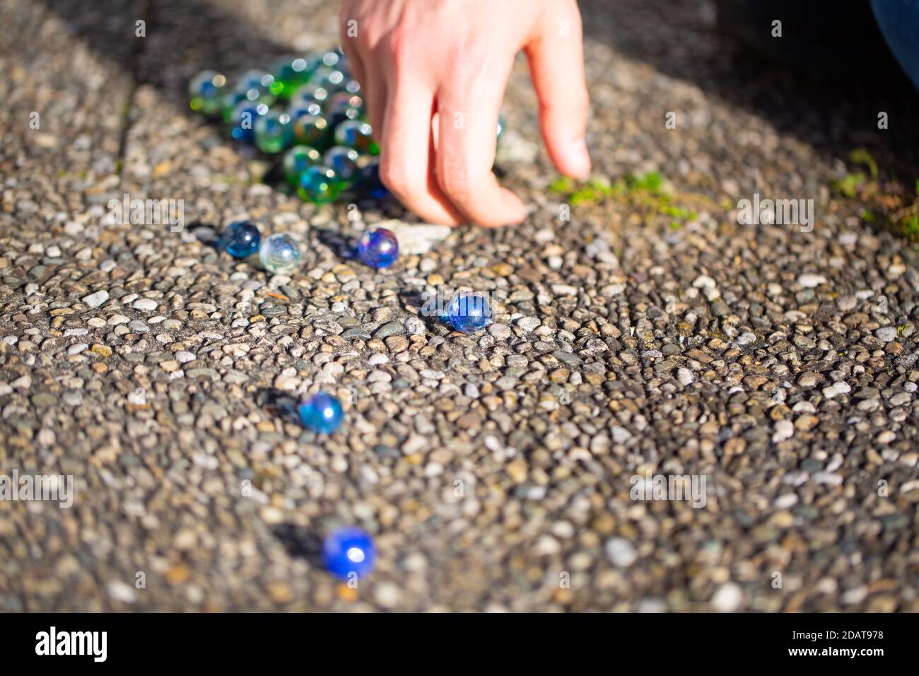 Playing marbles, old children's game, colorful balls Stock Photo - Alamy