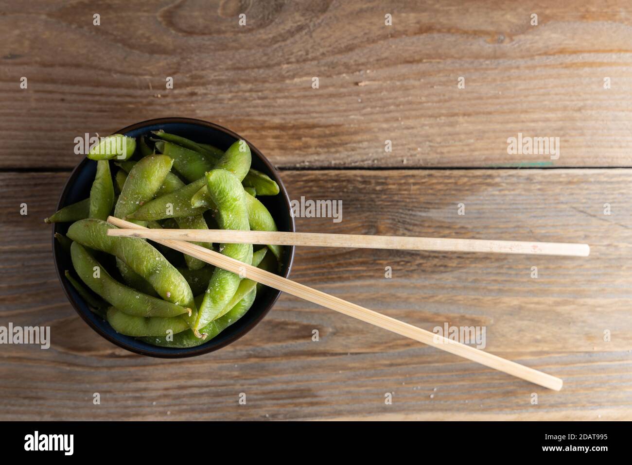 Japanese appetizer Edamame green soy beans seasoned with salt in a bowl ...