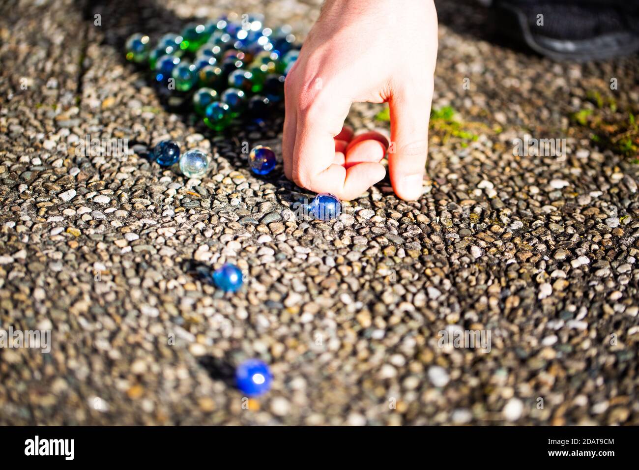 Playing marbles, old children's game, colorful balls Stock Photo - Alamy