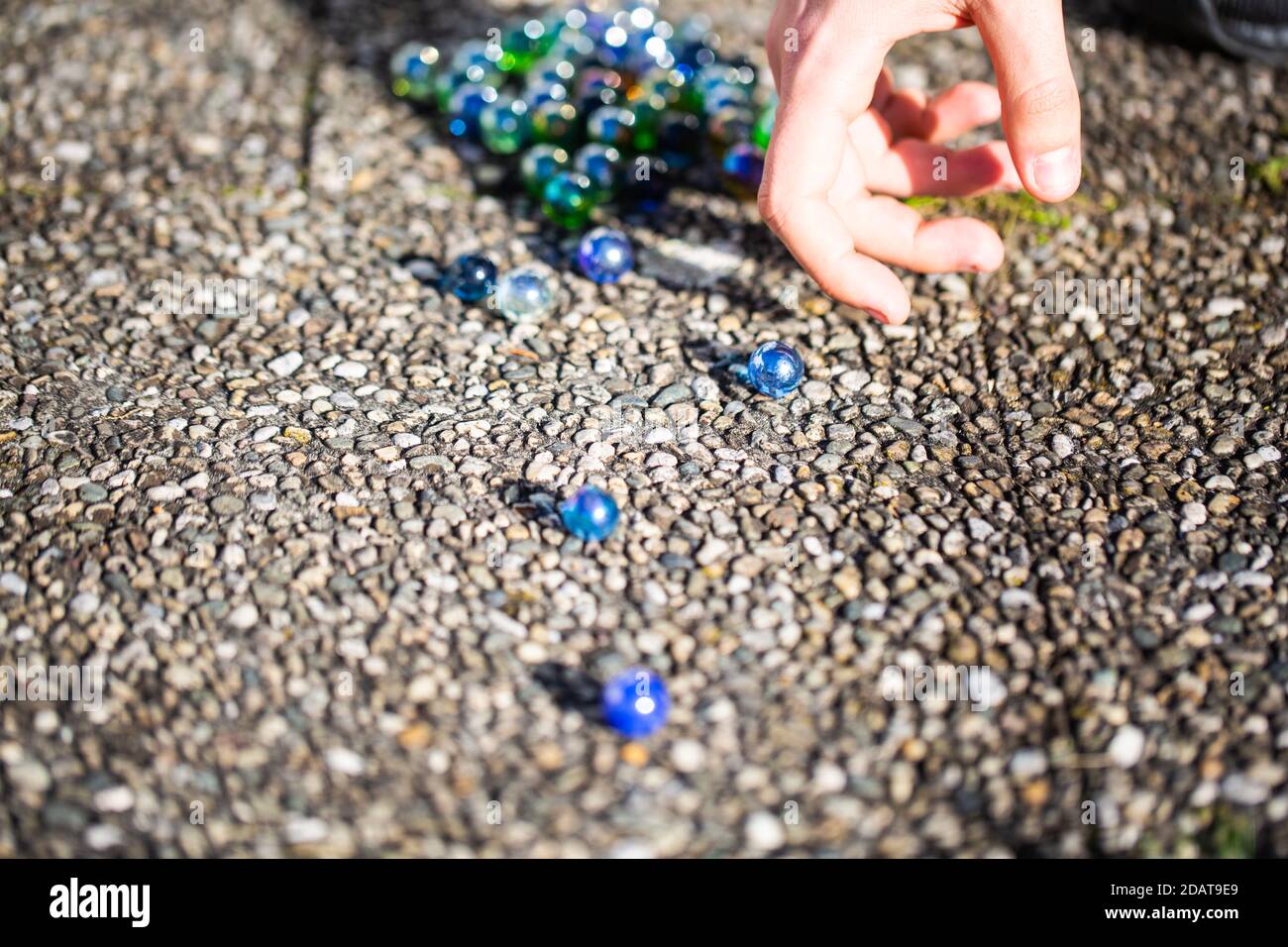 Playing marbles, old children's game, colorful balls Stock Photo - Alamy