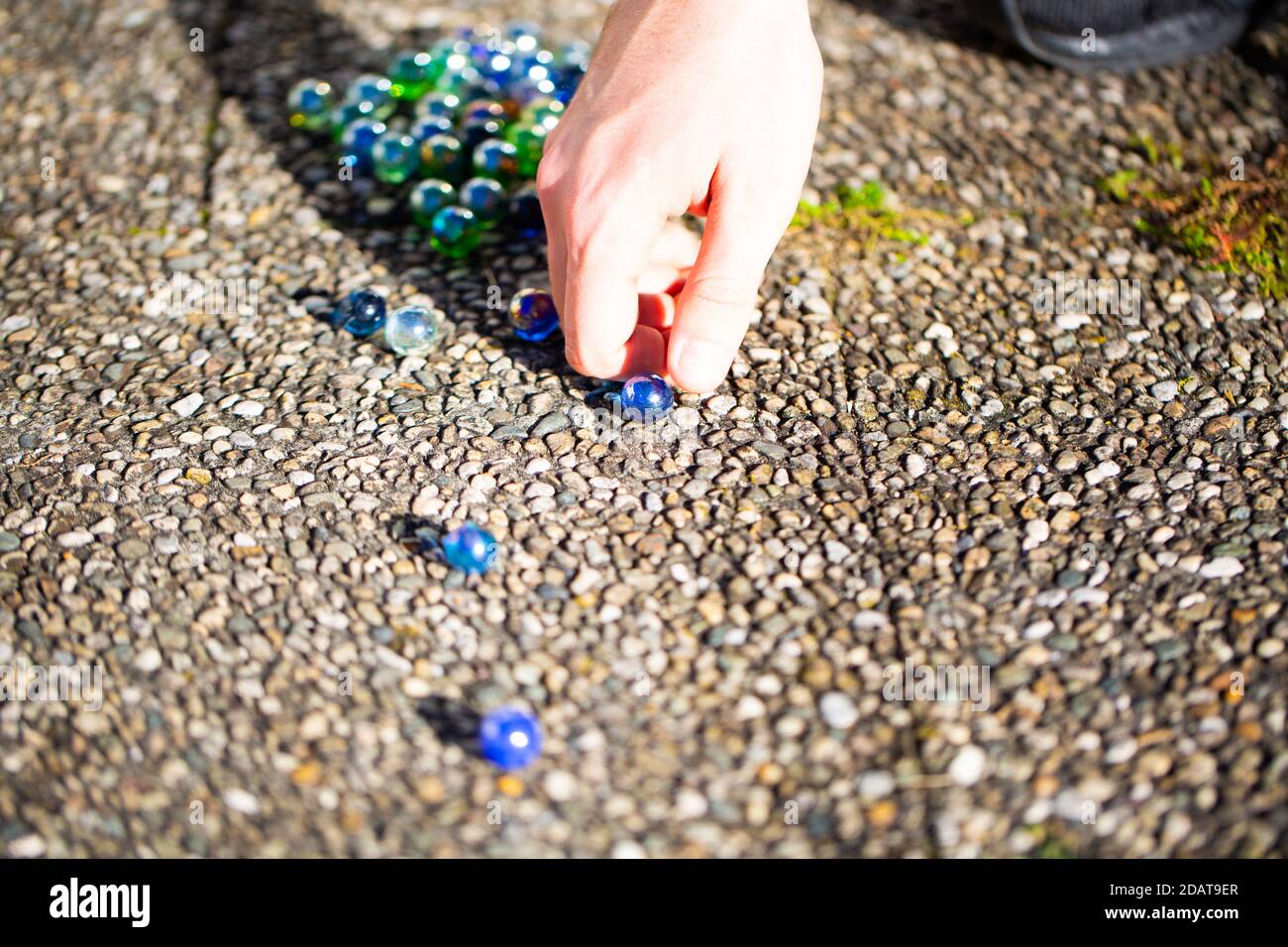 Playing marbles, old children's game, colorful balls Stock Photo - Alamy