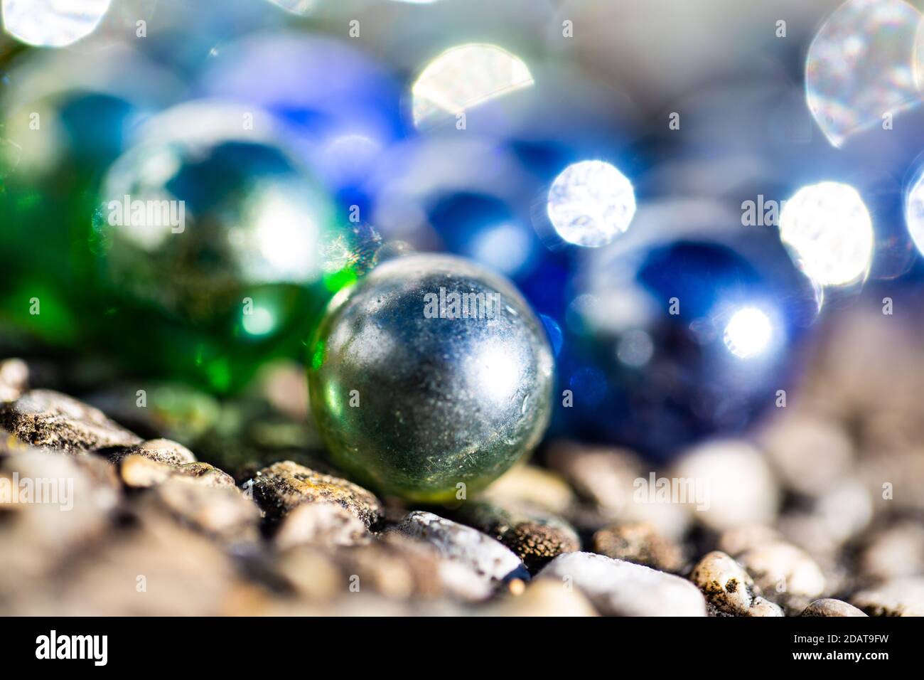 Playing marbles, old children's game, colorful balls Stock Photo - Alamy