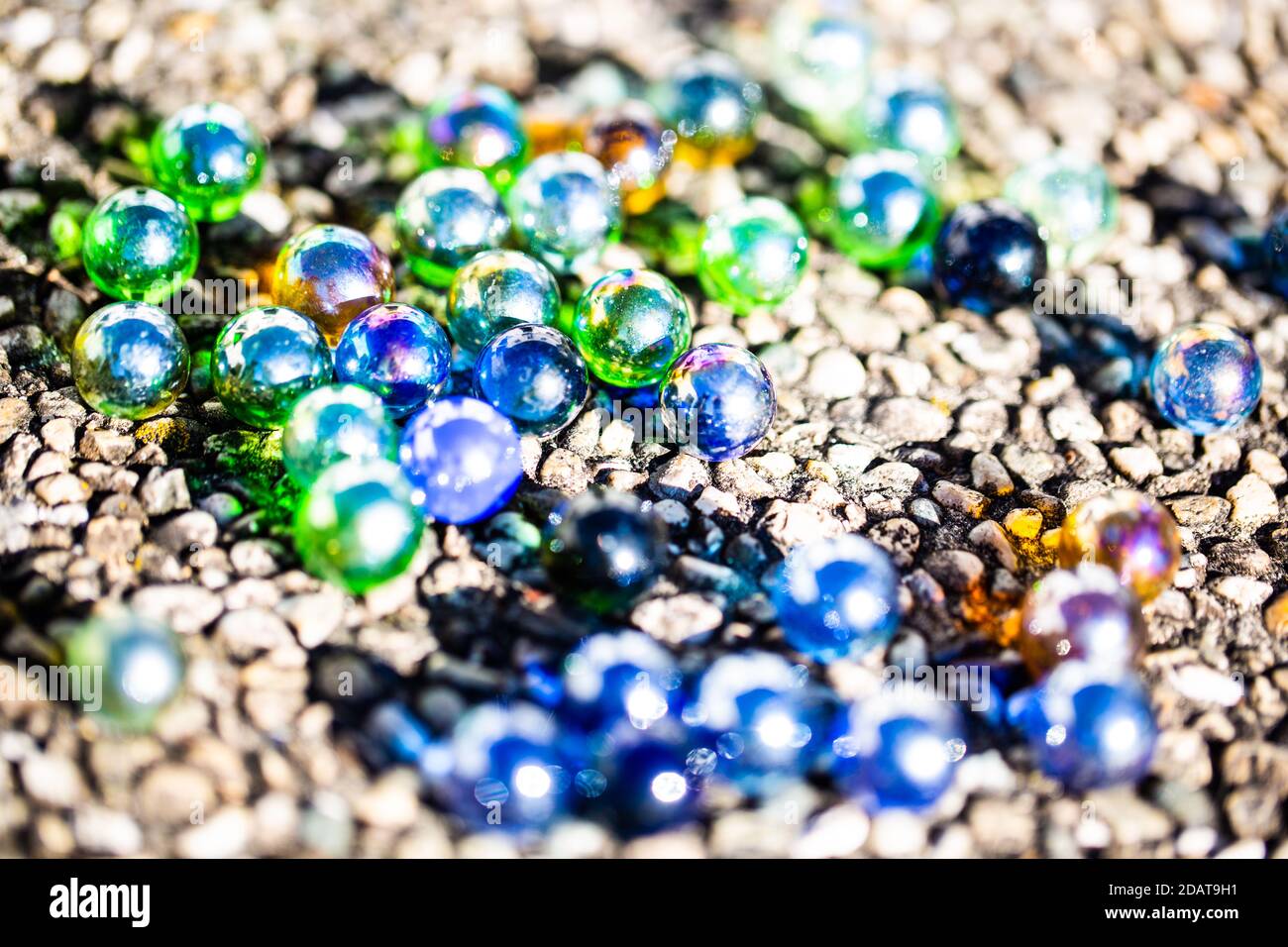 Playing marbles, old children's game, colorful balls Stock Photo - Alamy