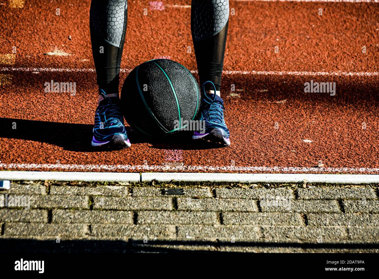 Powerfull image to promote sport or sorts. With ball between elgs on ...