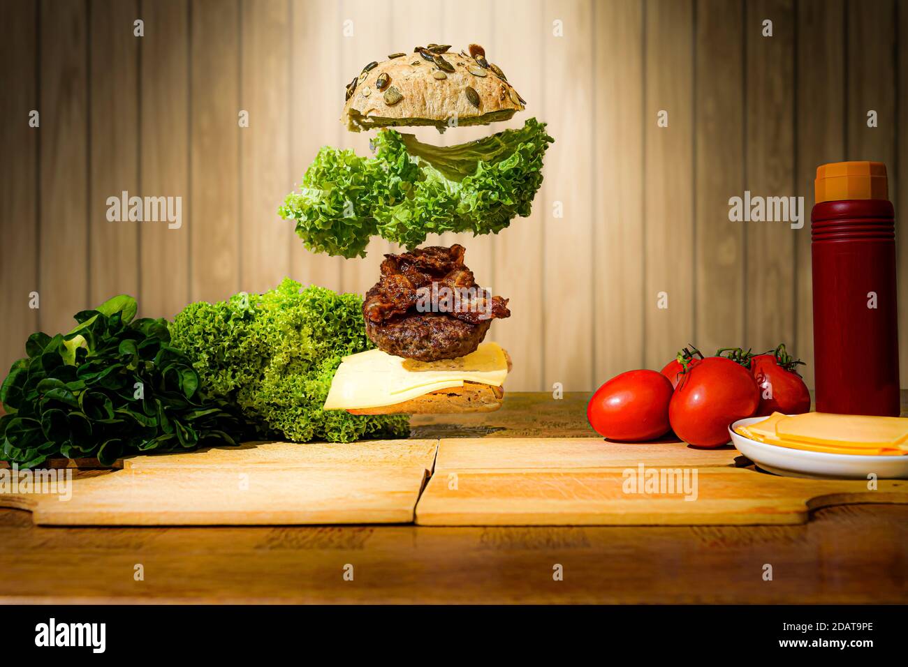 Flying burger on wood. Studio work of food. Studiowork of hamburger ...