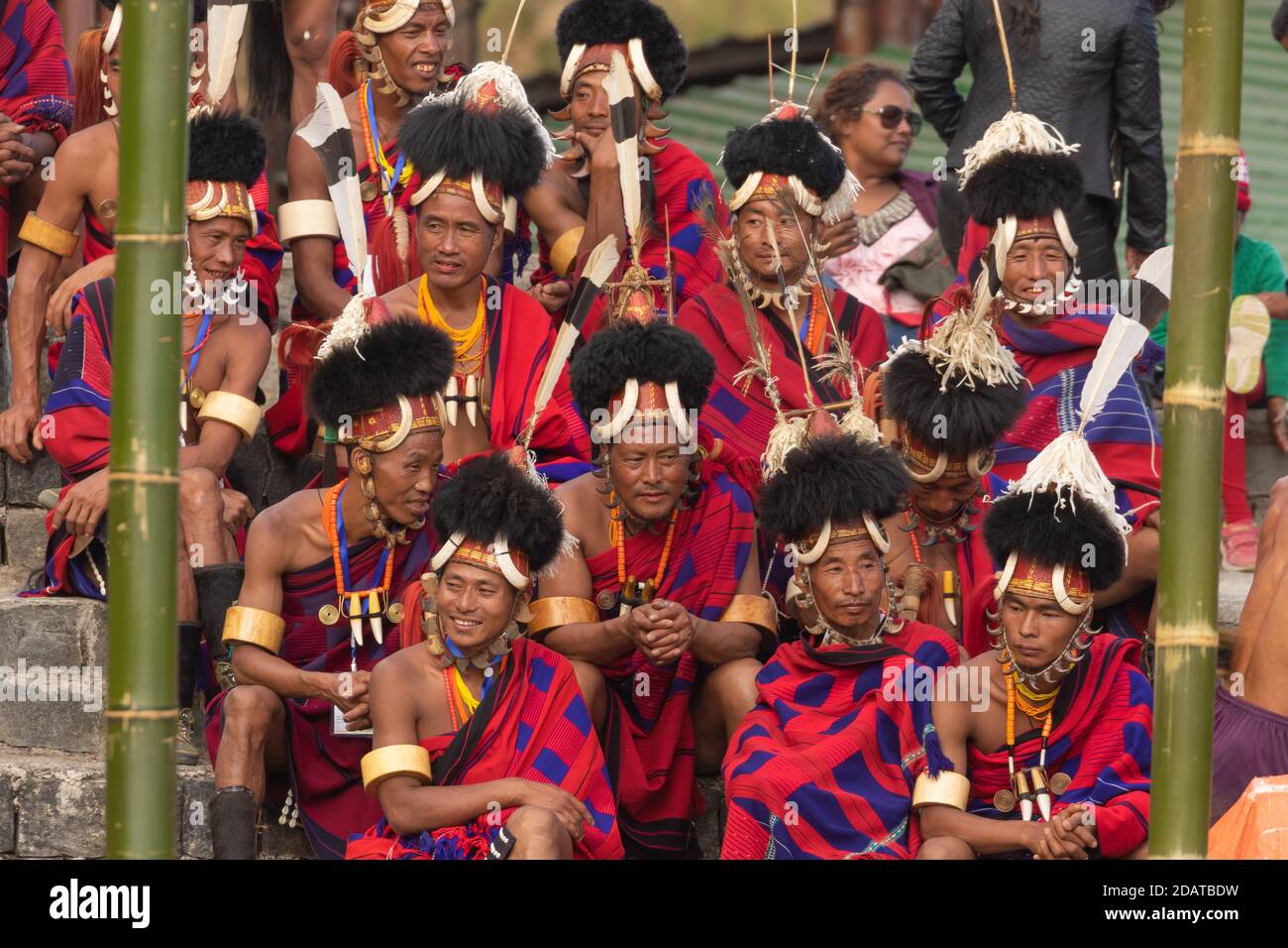 Naga tribesmen wearing their traditional attire and siting together in ...
