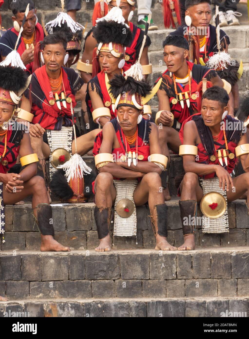 Naga tribesmen wearing their traditional attire and siting together in ...