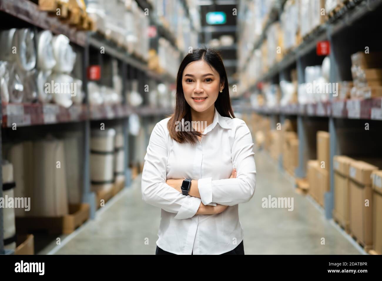 Portrait female warehouse standing arms hi-res stock photography and ...