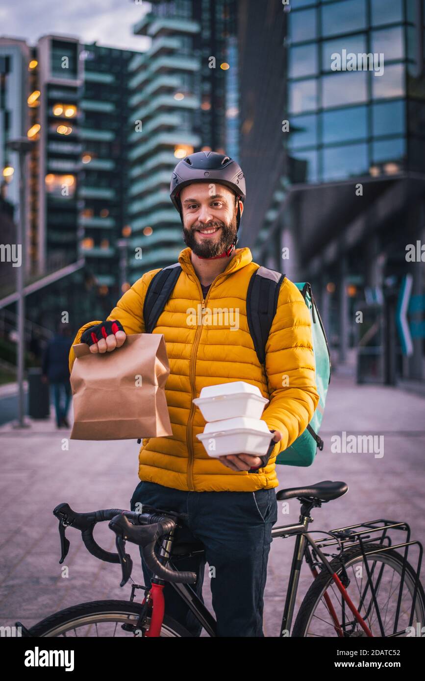 Food delivery service, rider delivering food to clints with bicycle ...
