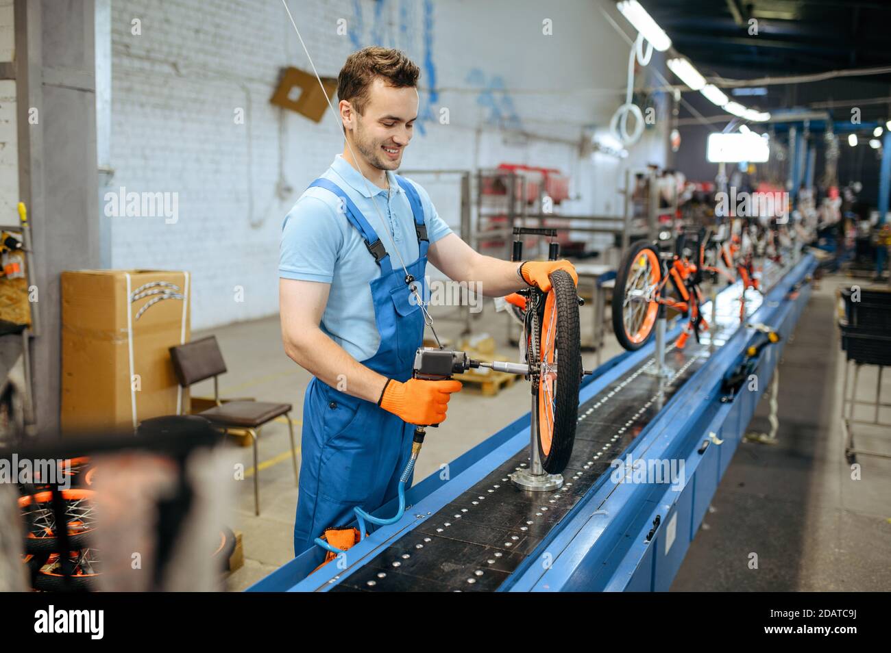 Bicycle factory, assembly line, chain installation Stock Photo - Alamy
