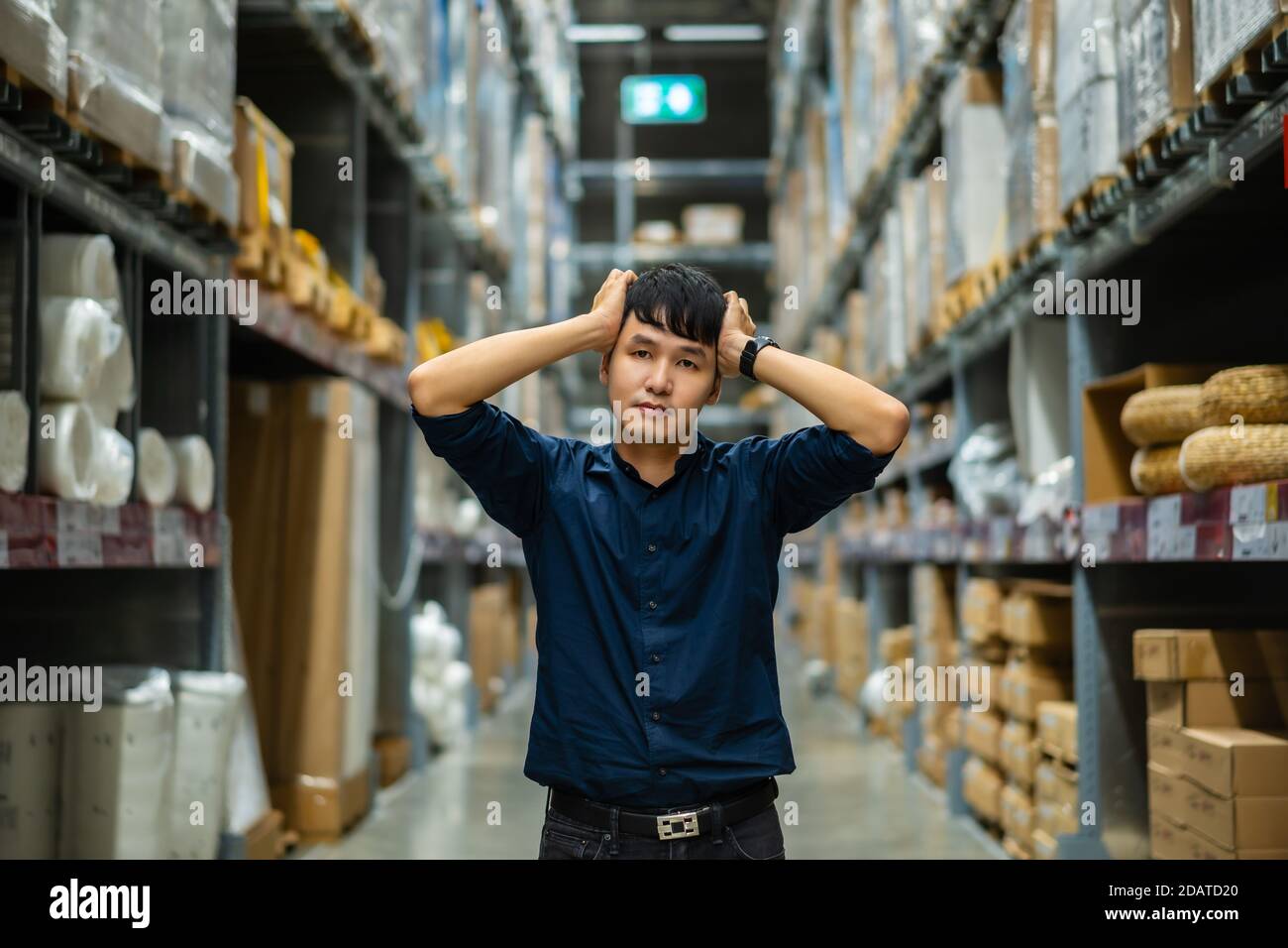 stressed male manager in the warehouse store Stock Photo - Alamy