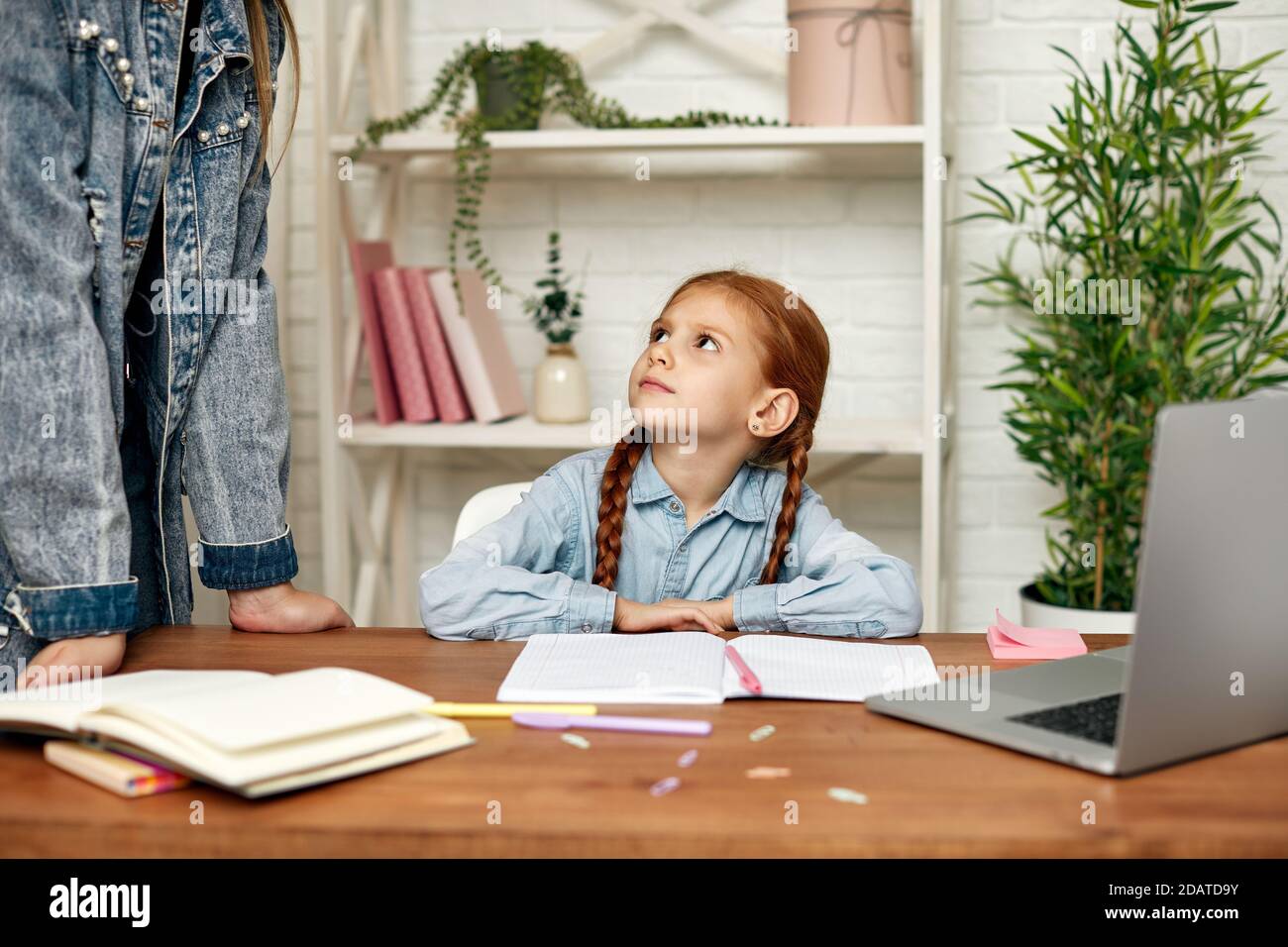 little child girl child does not want to study online. mom makes ...