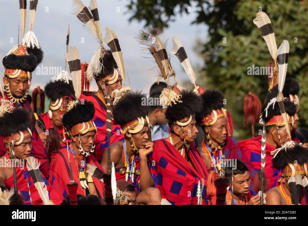 Naga tribesmen wearing their traditional attire and siting together in ...
