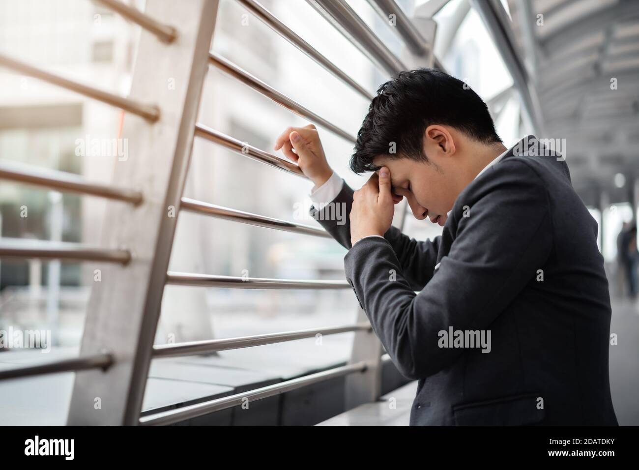 stressed business man in suit in the city Stock Photo - Alamy