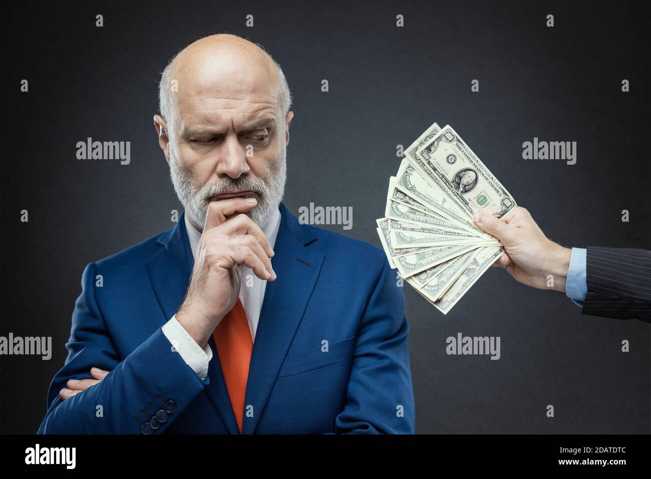 People offering bribes to a politician, he is thinking with hand on ...