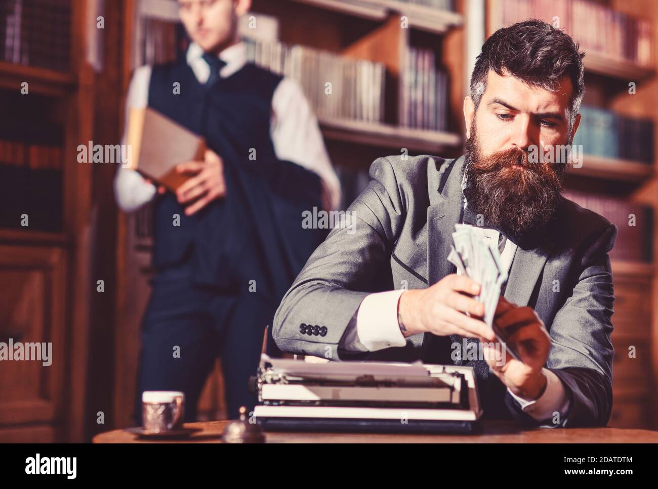 Writing and fees concept. Man in oldfashioned suit holds money. Writer ...