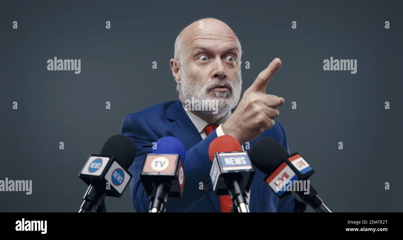 Aggressive politician giving a speech at the press conference, he is ...