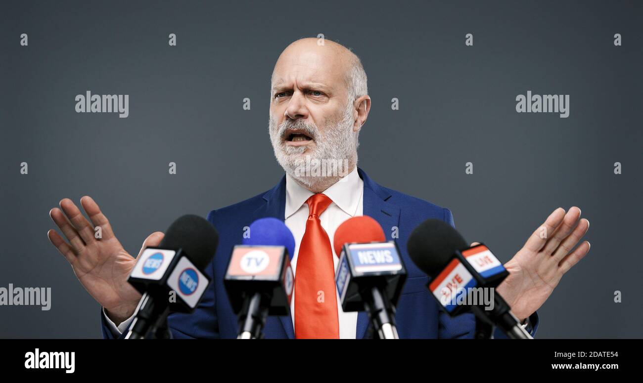 Confident politician giving a speech at the press conference, election ...