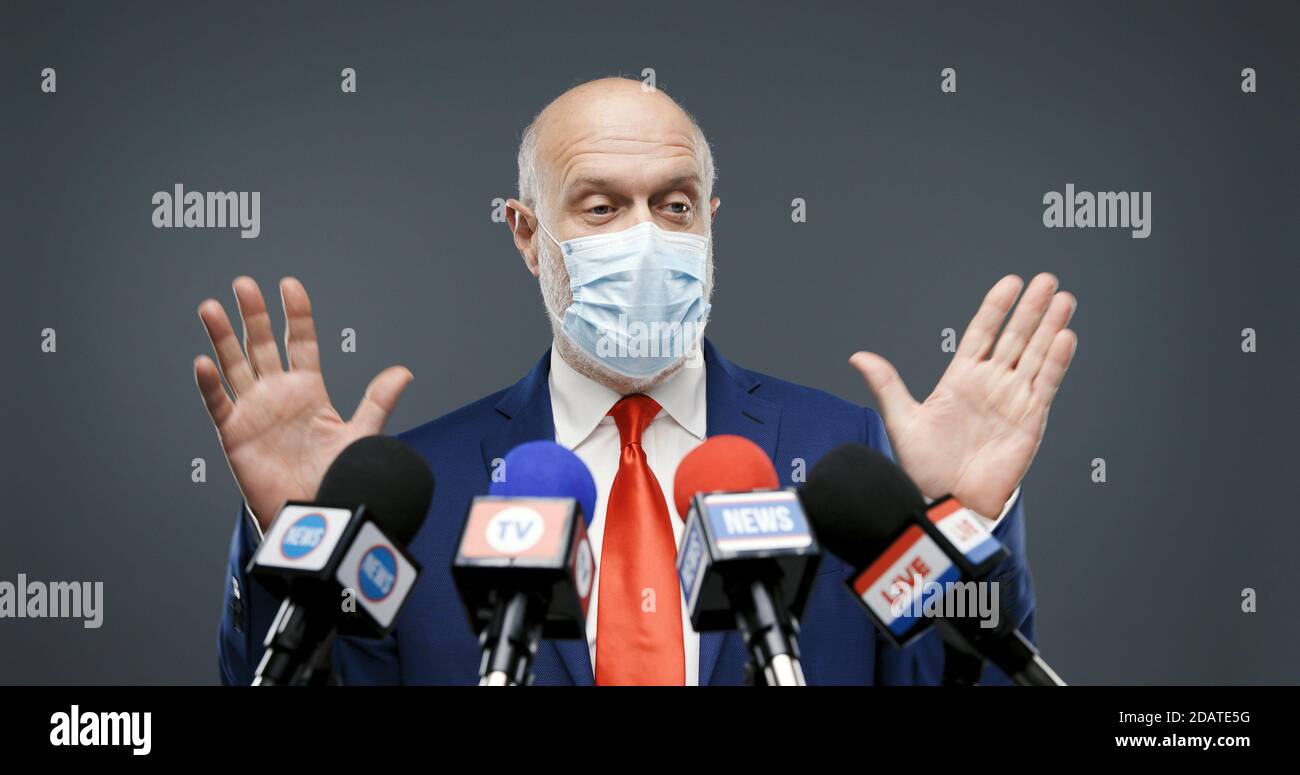Politician wearing a surgical mask and giving a speech, coronavirus ...
