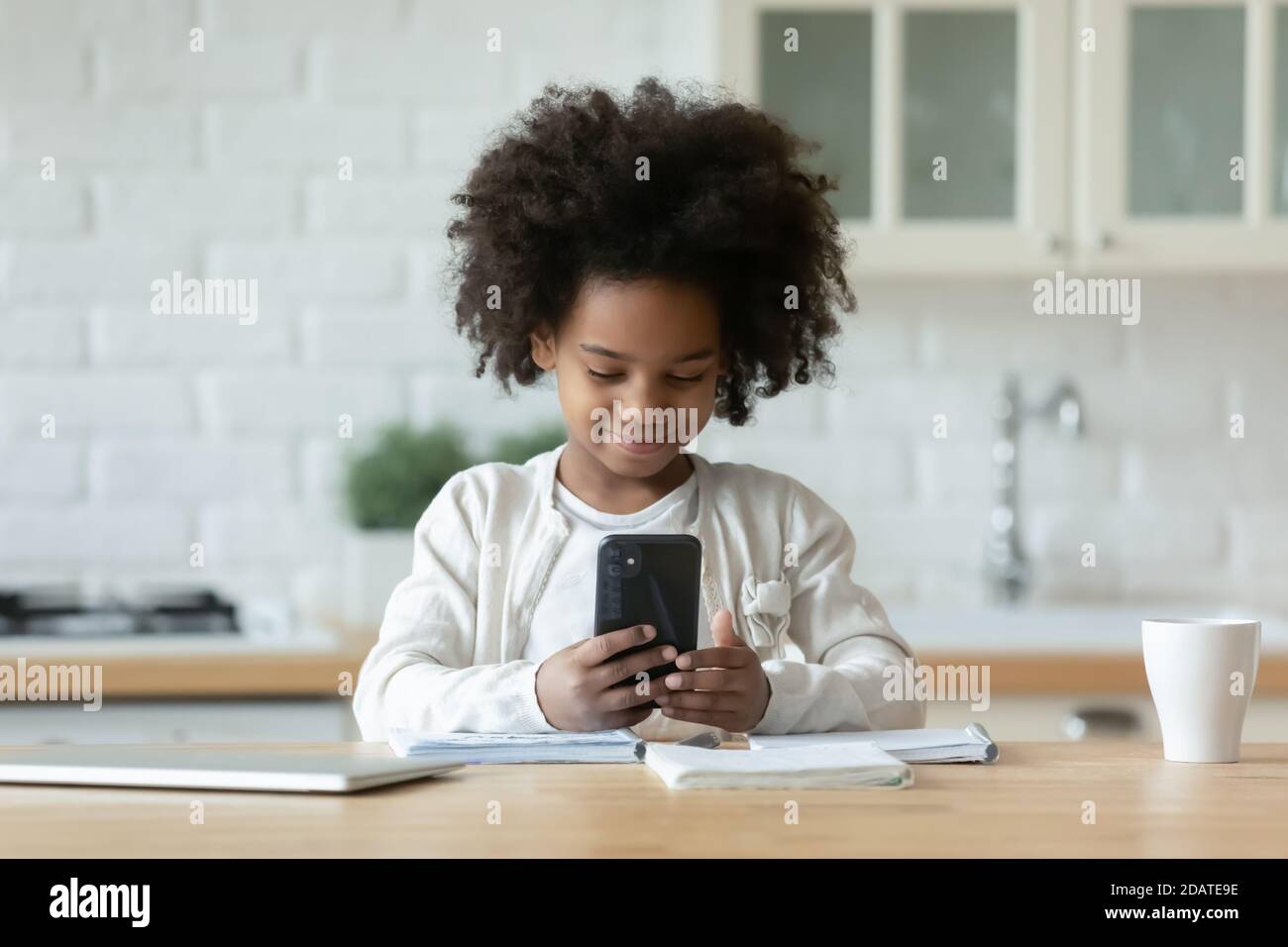 African school girl using phone hi-res stock photography and images - Alamy