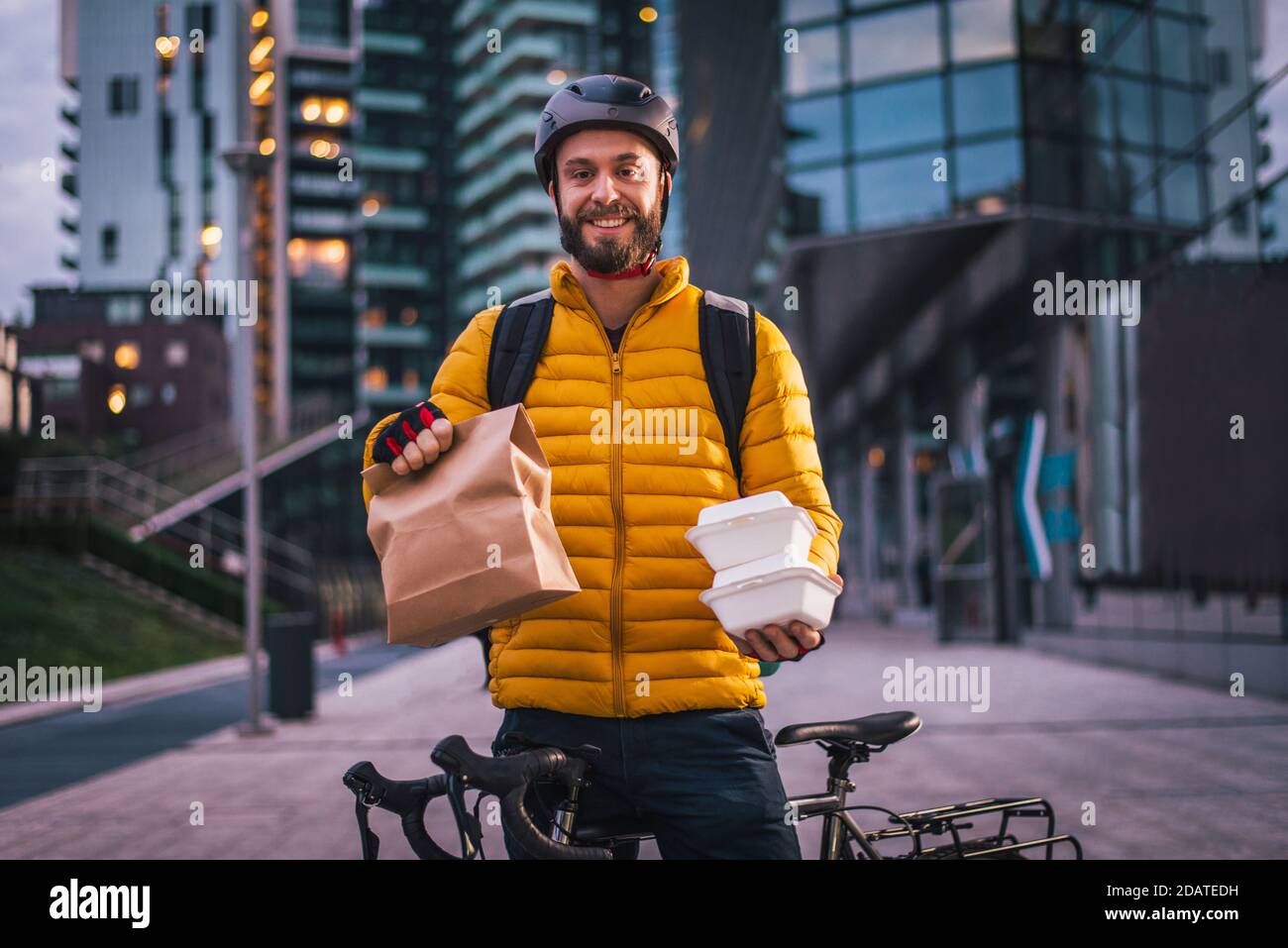 Food delivery service, rider delivering food to clints with bicycle ...