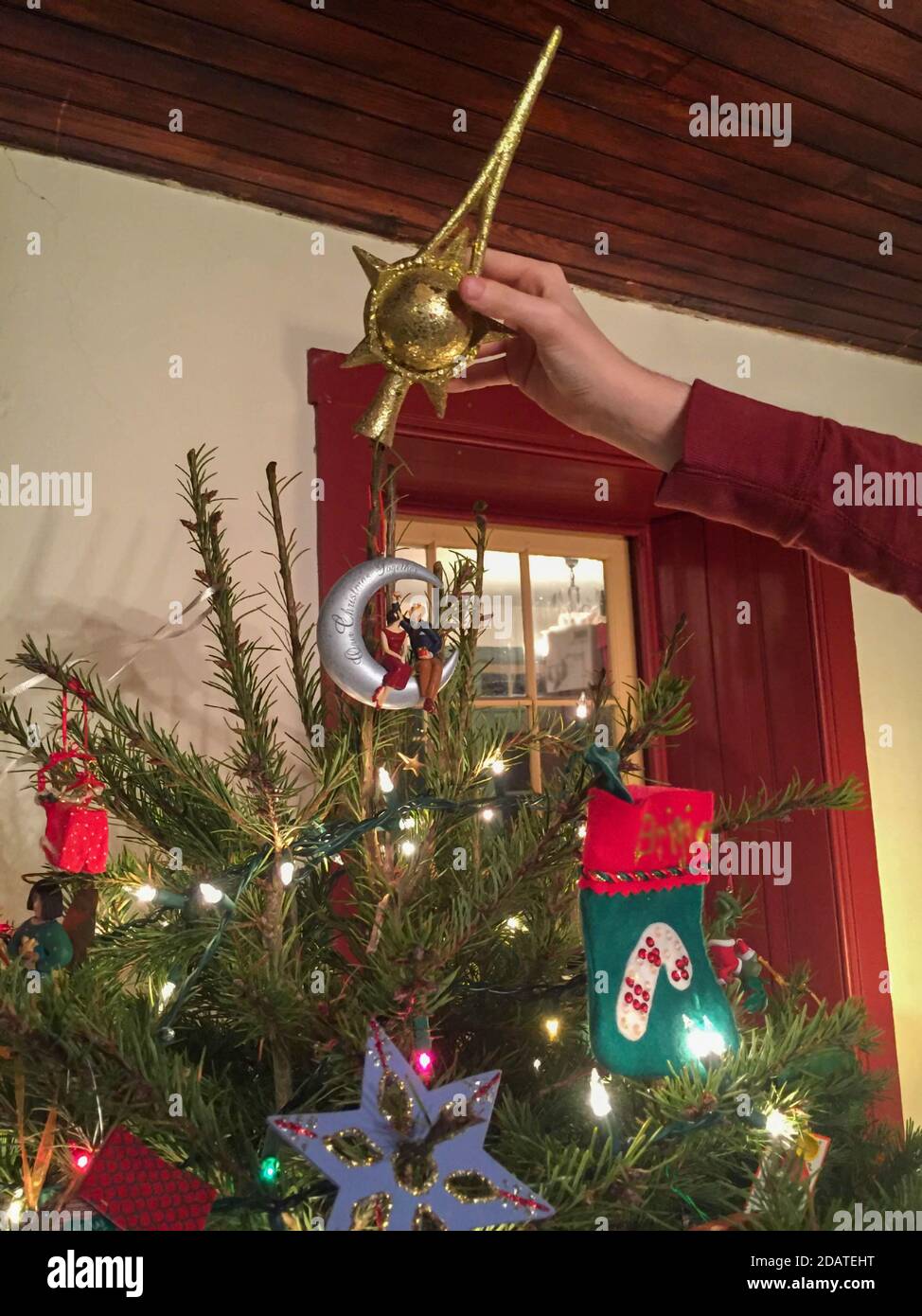 Putting lights on a christmas tree hi-res stock photography and images ...
