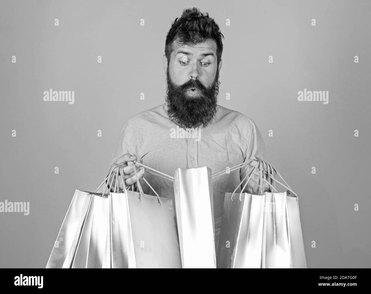 Sale and discount concept. Hipster on shocked face shopping addicted or ...