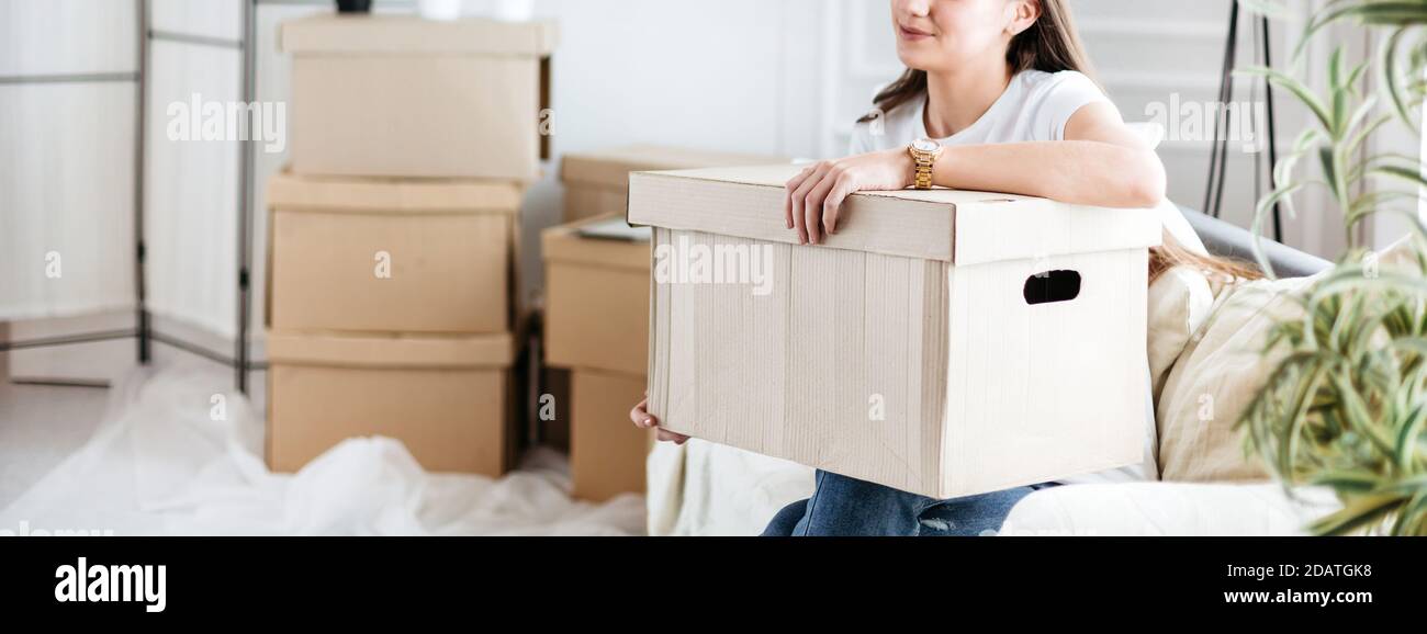 Woman unpack large box hi-res stock photography and images - Alamy