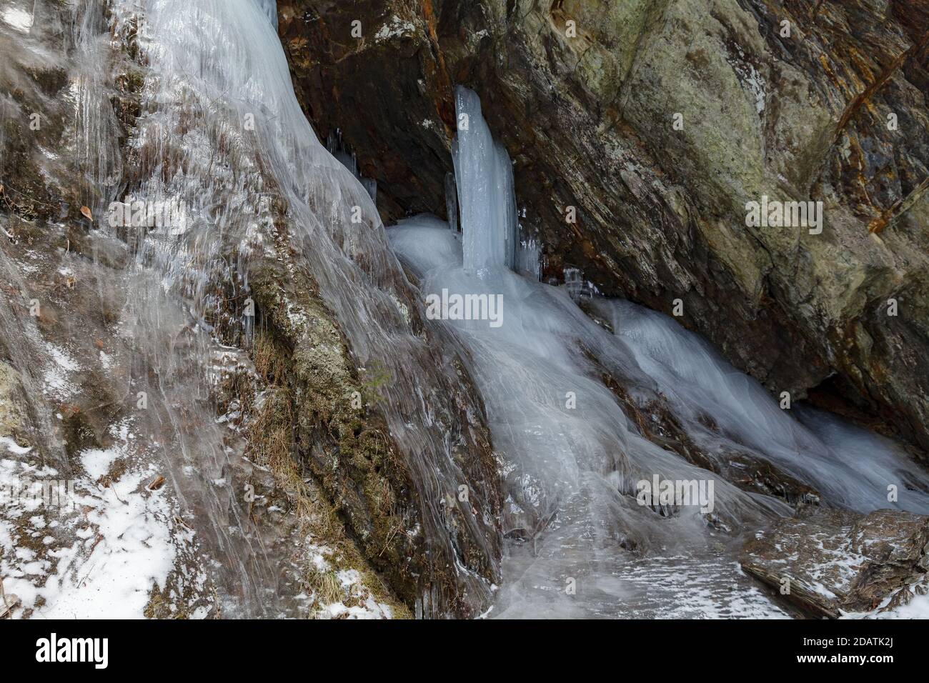 Moss Glen Falls in winter after snow storm. Water turned into ice and ...