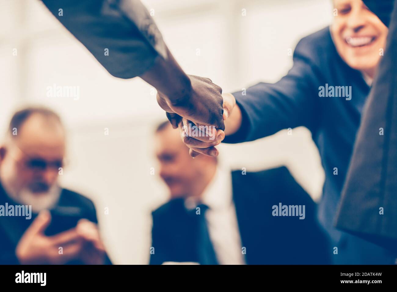 smiling business partners confirming the deal with a handshake Stock ...