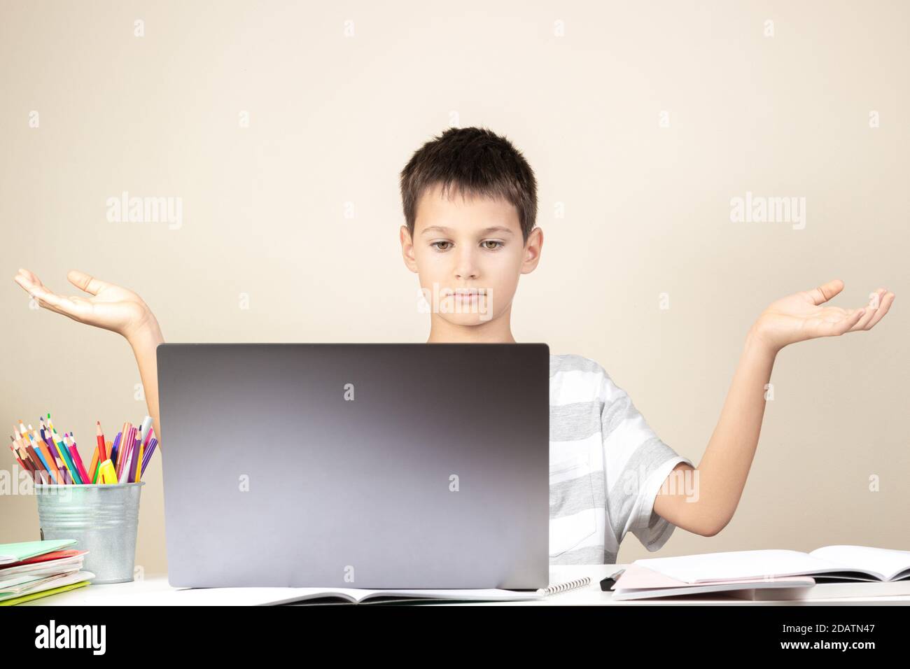 Kid with laptop computer having learning problem, do not understand ...